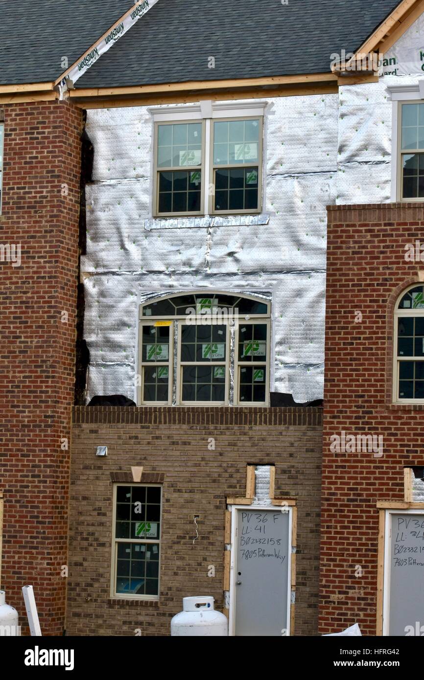A new home construction site with new homes that are in the process of ...