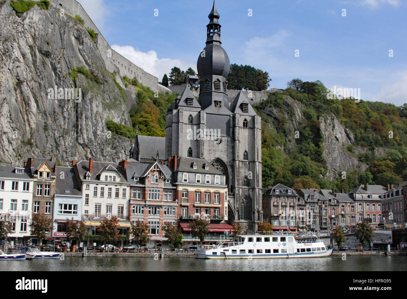 Church of Our Lady in Dinant Belgium towers over the city with cruise ...