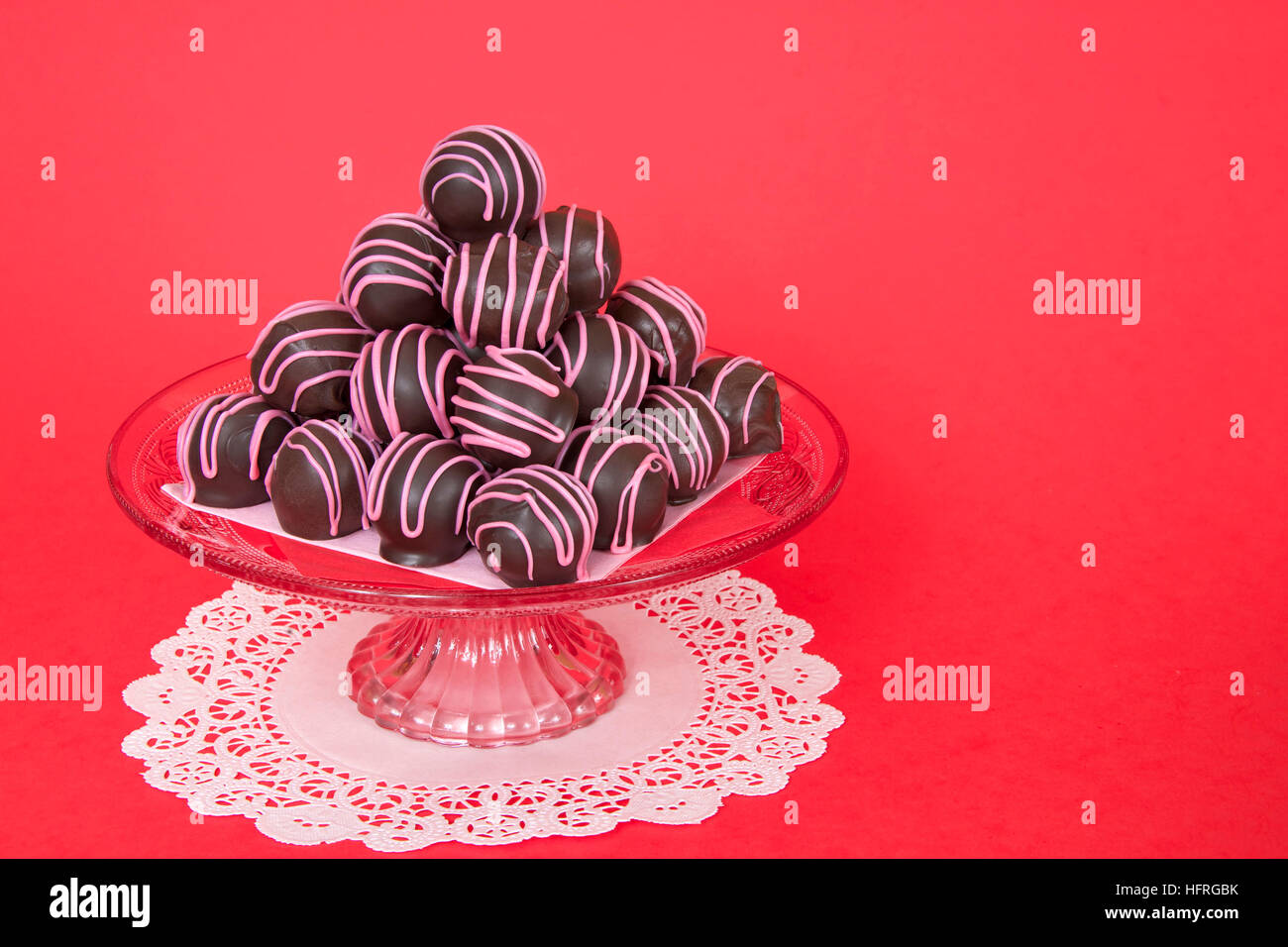 hocolate cake balls stripped with pink candy melts stacked pyramid ...