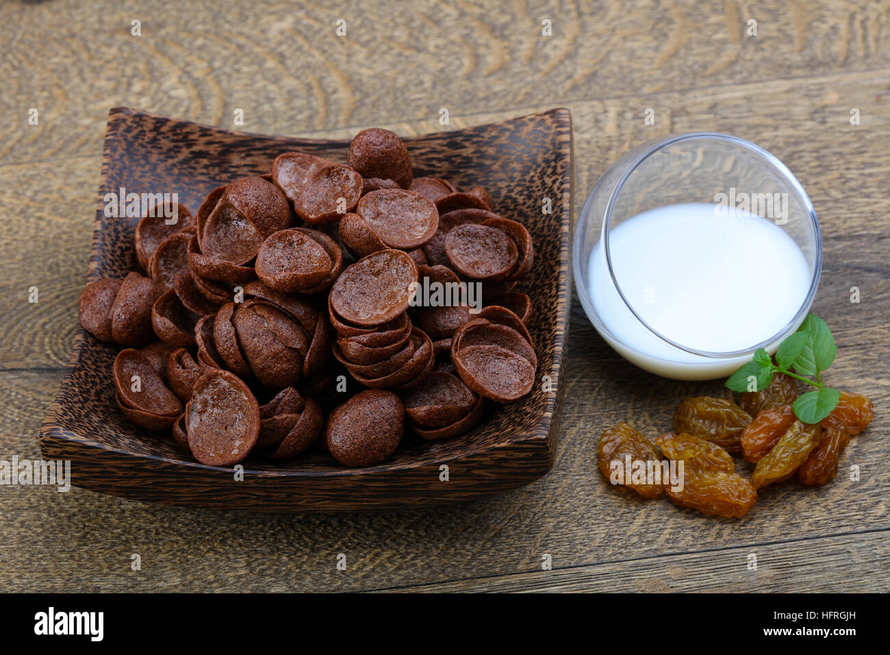 Choco corn flakes with milk and raisin Stock Photo - Alamy