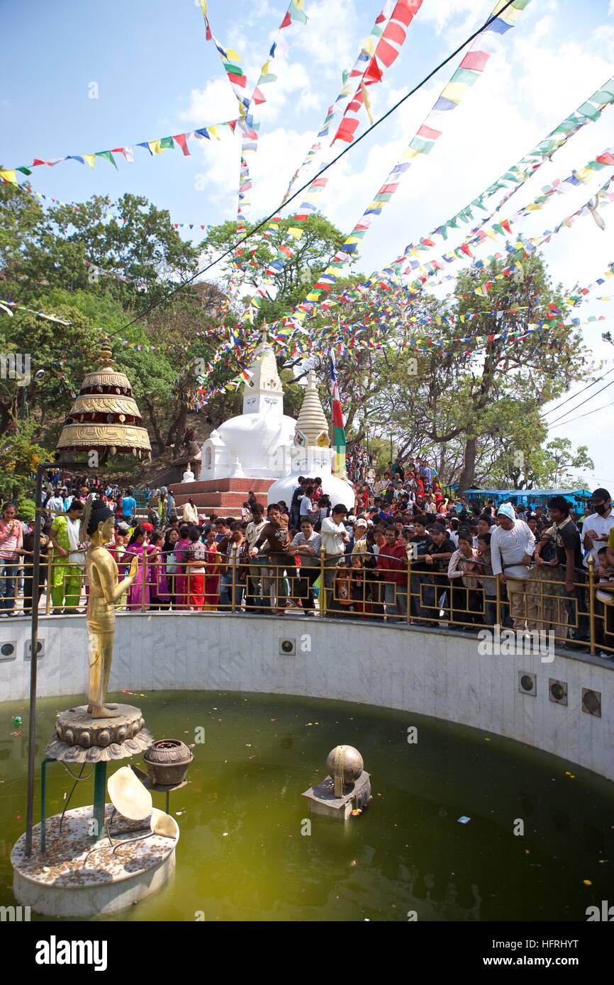 Nepal Kathmandu Asia temple crowd lucky pond coins Buddhism stupa ...