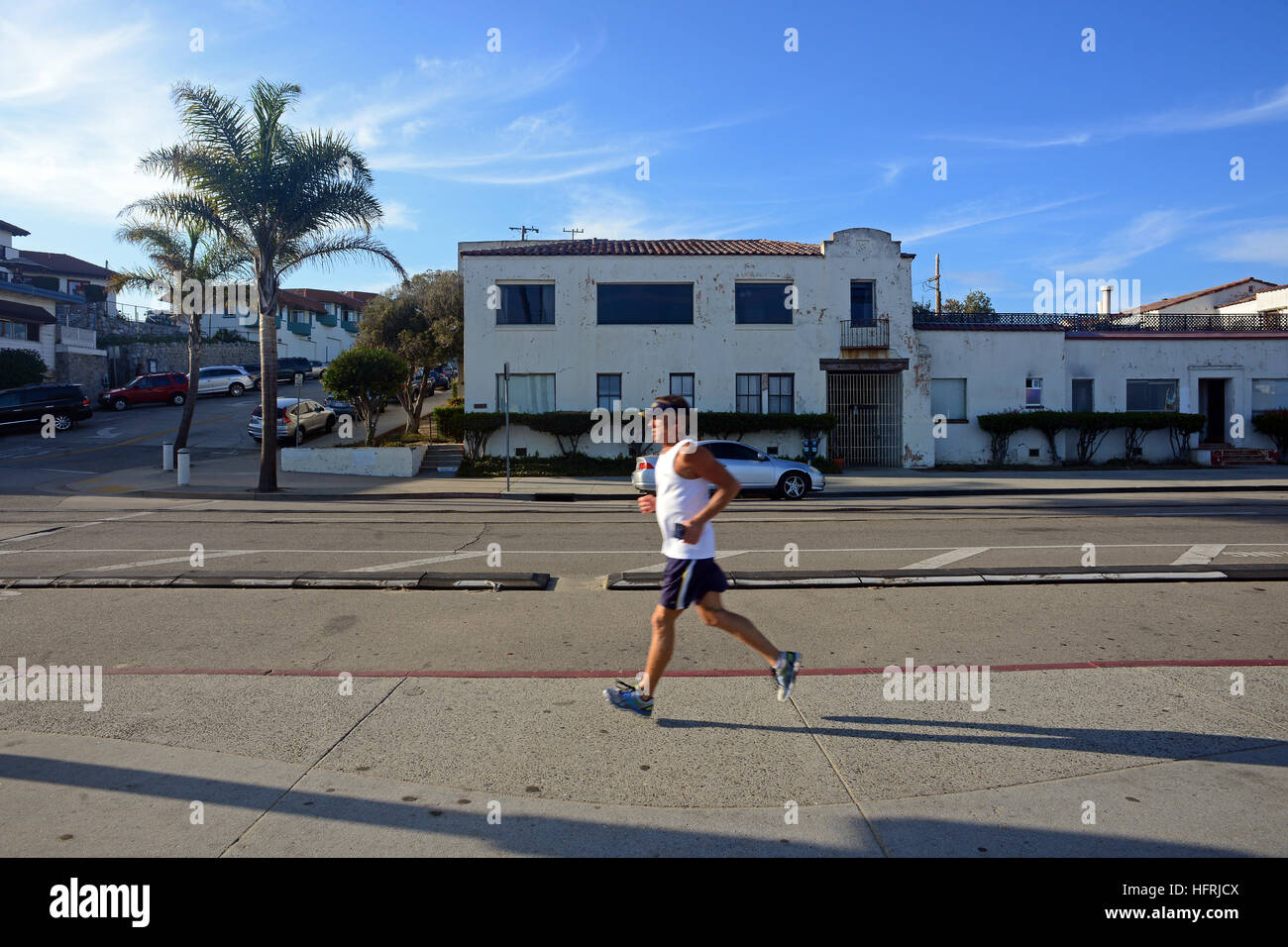Mature man running in Santa Cruz boardwalk, California Stock Photo - Alamy