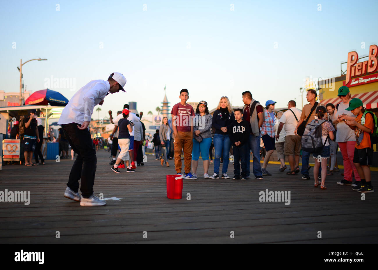 Street popping dancer performing in Santa Monica pier, California Stock ...