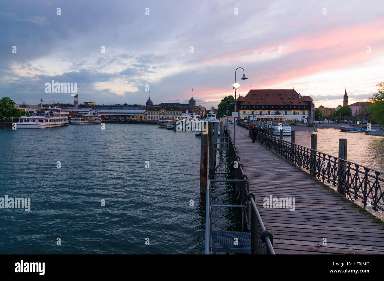 Konstanz, Constance: Port with council building (right) at sunset ...