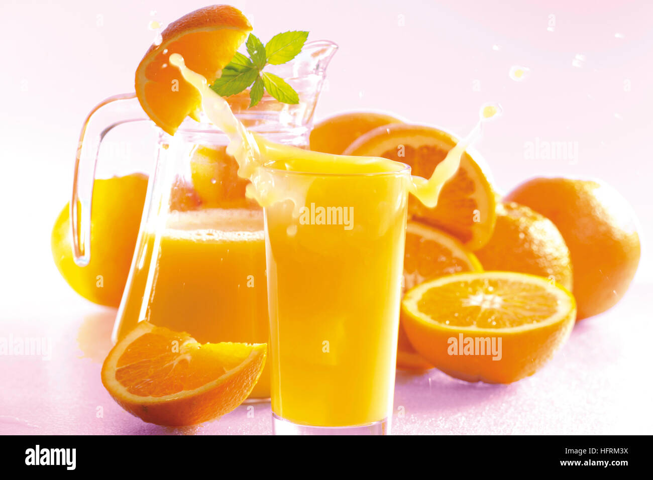 Orange juice, splashing Stock Photo - Alamy