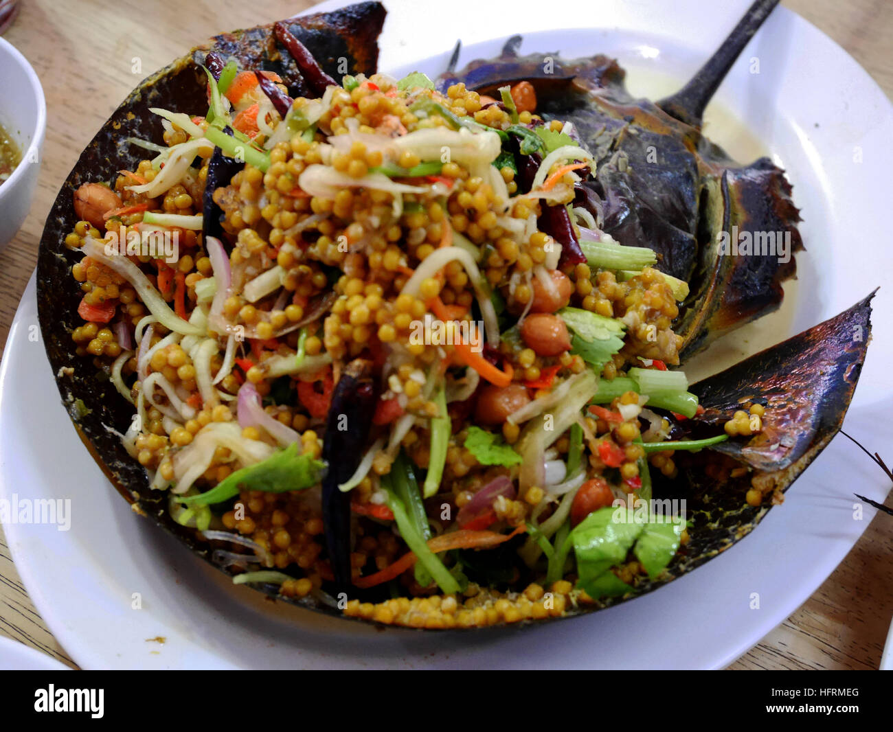 Thai cuisine Spicy Horseshoe Crab Egg Salad in restaurant Thailand Stock Photo - Alamy