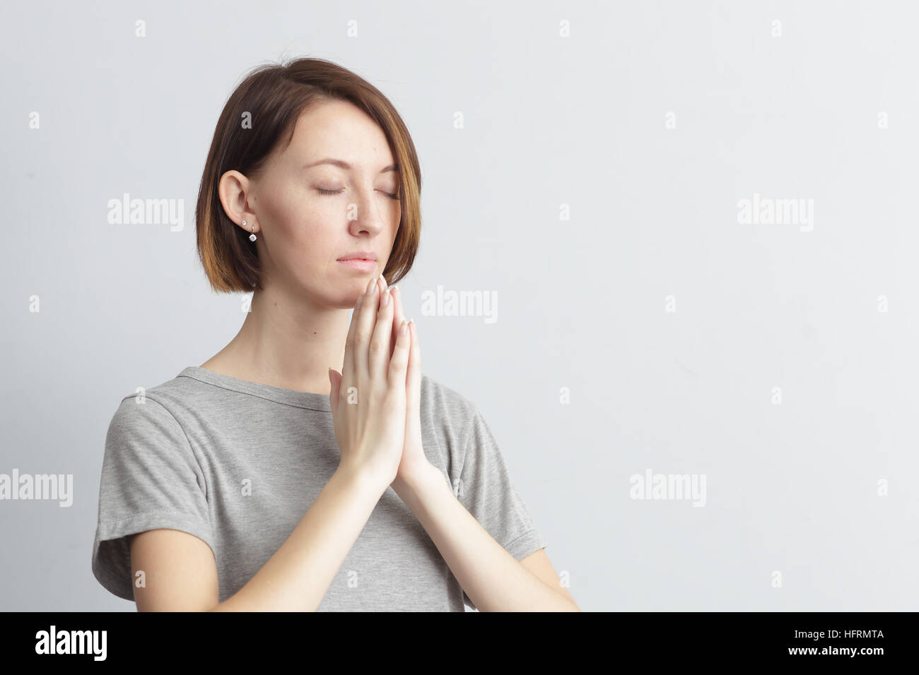 Meditate or make a wish, trying to calm down Stock Photo - Alamy