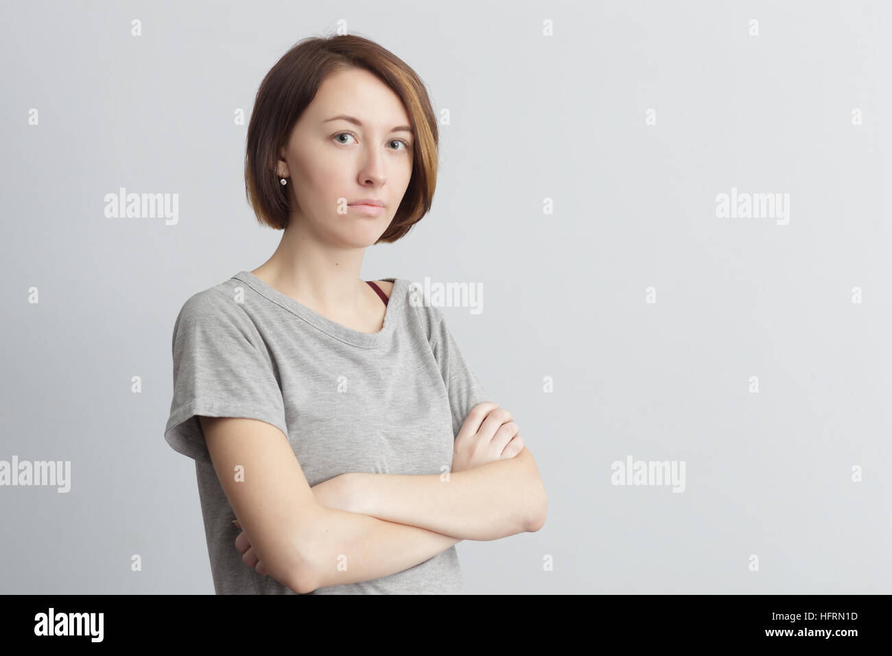 Portrait of unsure young woman Stock Photo - Alamy