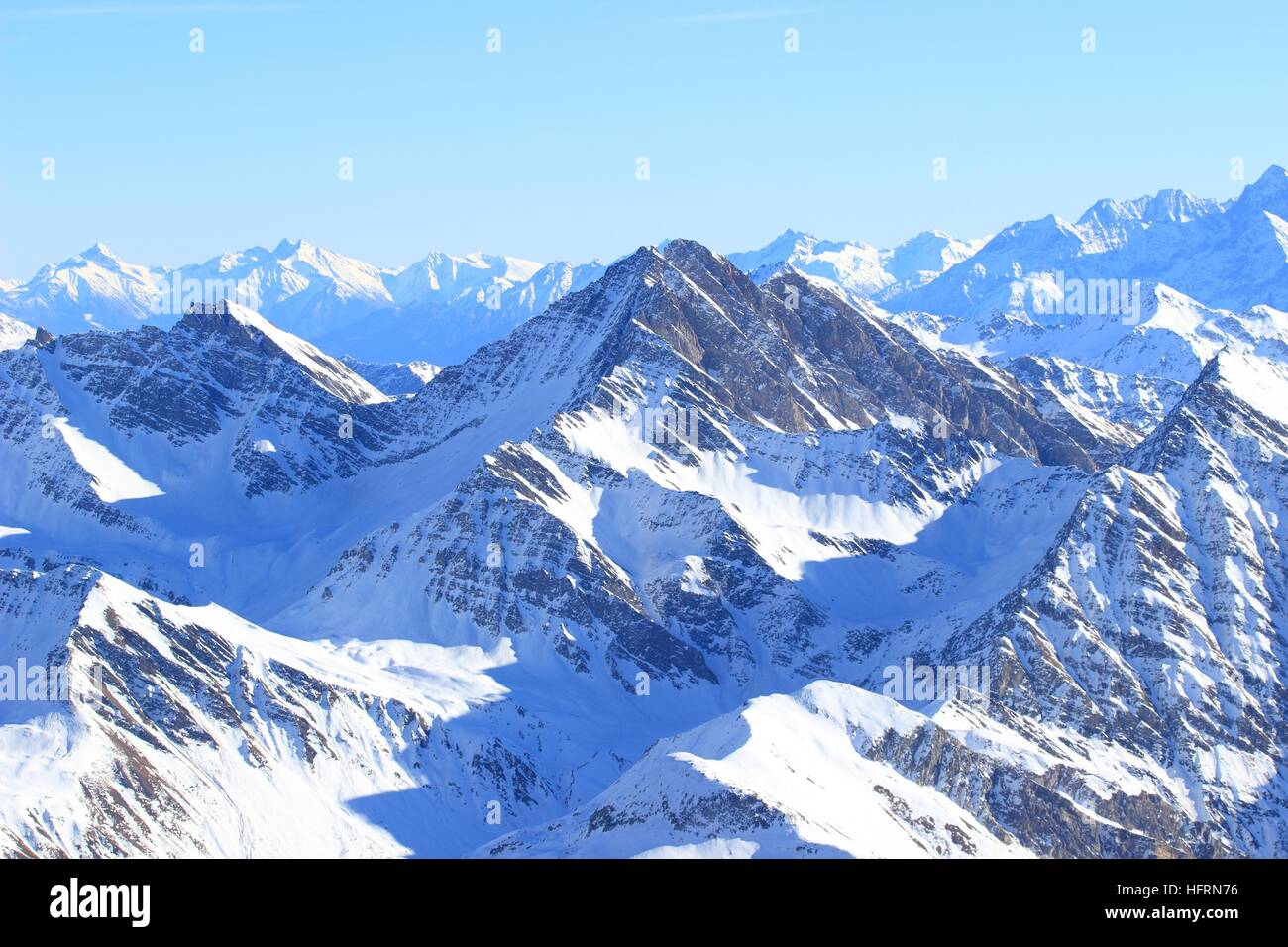Alpine peaks under snow, winter scene Stock Photo - Alamy