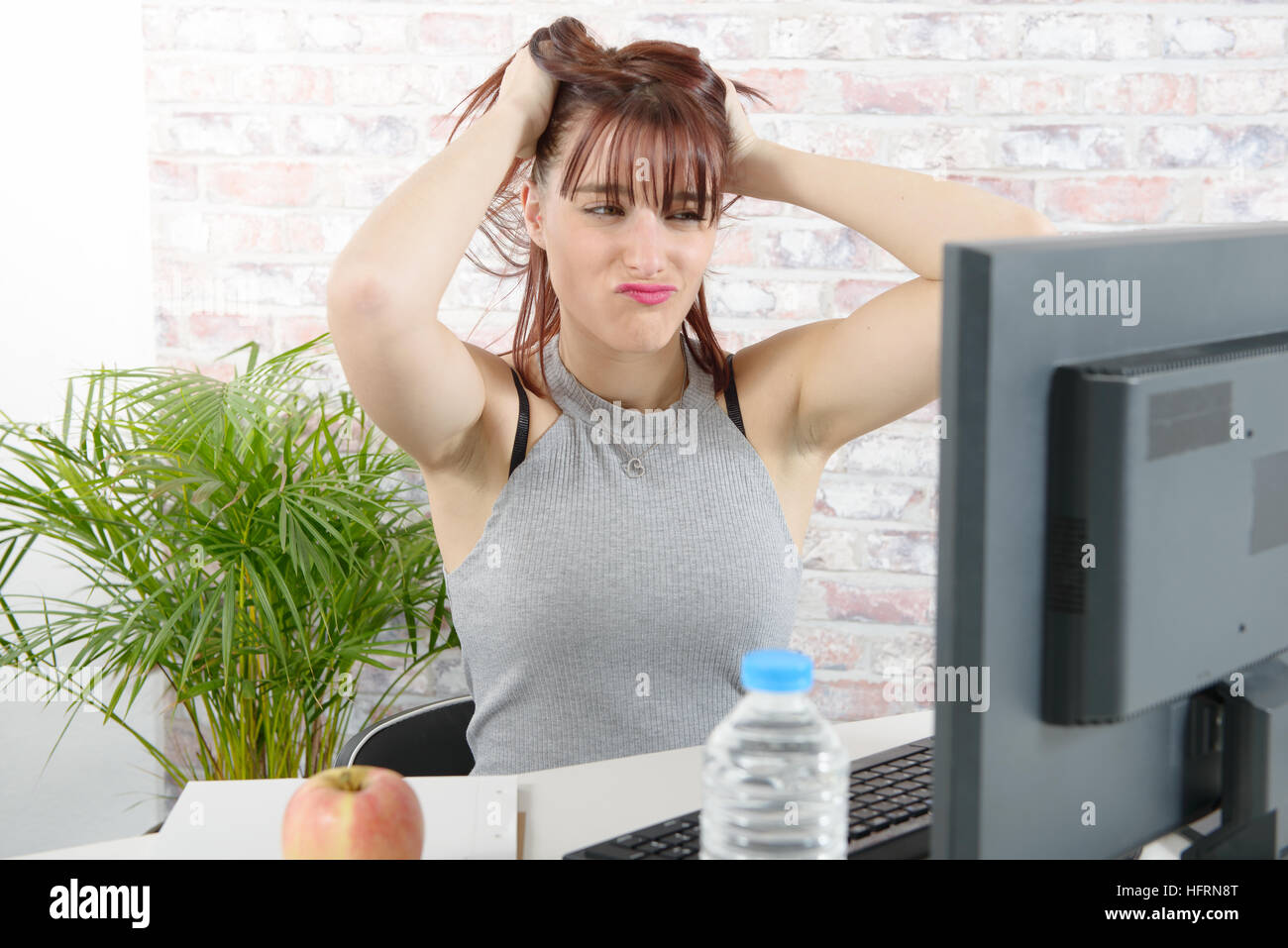 angry young woman working on laptop Stock Photo - Alamy