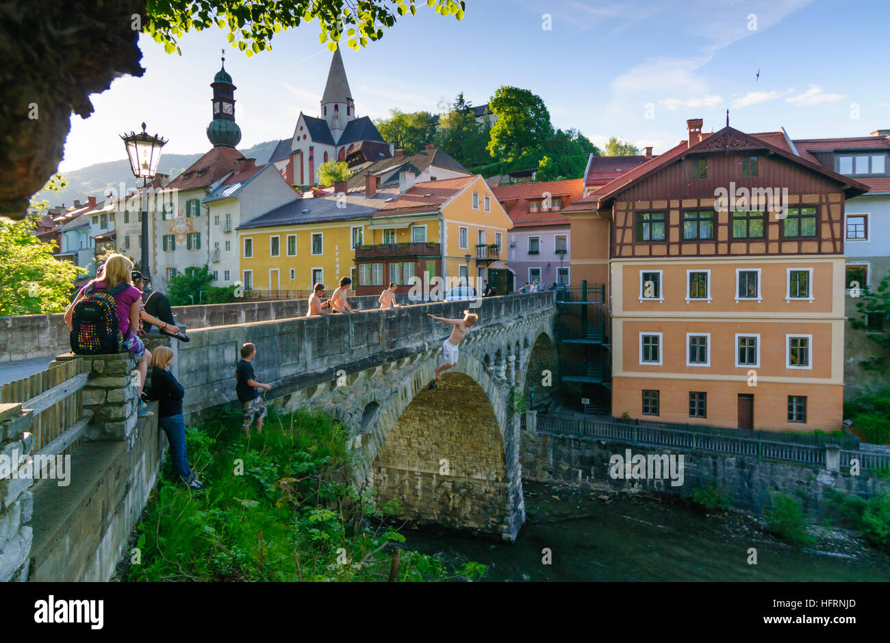 Murau: Children jumping from a bridge in river Mur, Murtal, Steiermark ...
