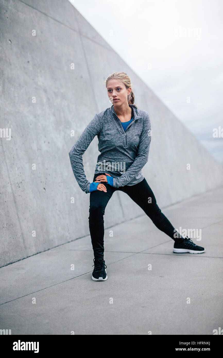 Stretching woman fitness runner hi-res stock photography and images - Alamy