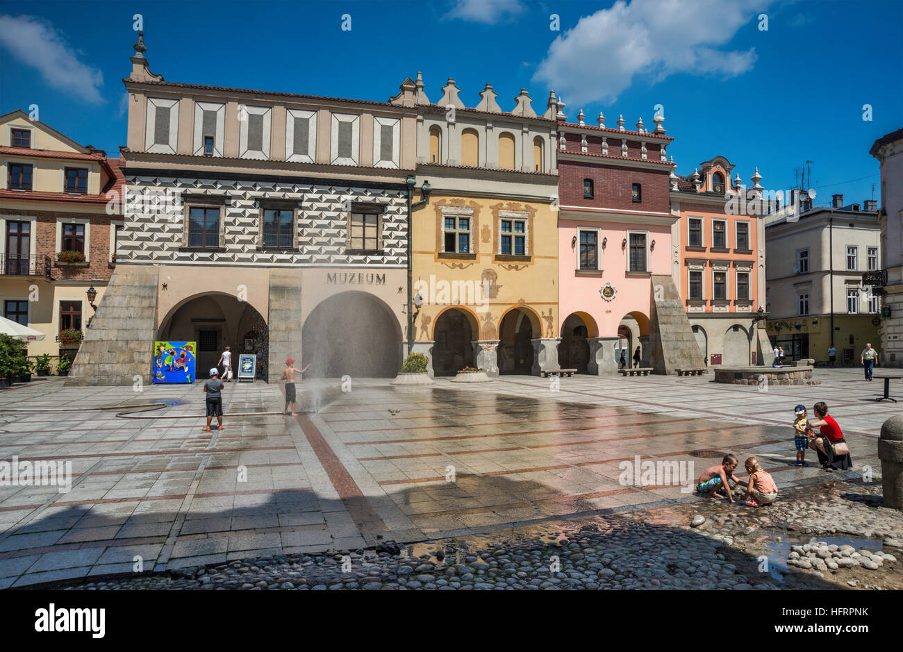 Kids playing at water hose on a hot summer day, burgher houses Nos. 19 ...