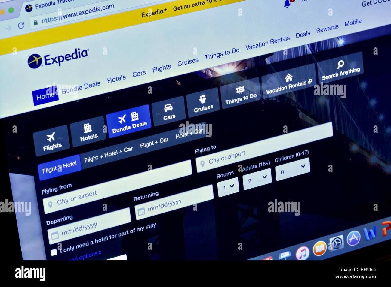 An Apple Macbook Pro displaying the Expedia travel booking website ...