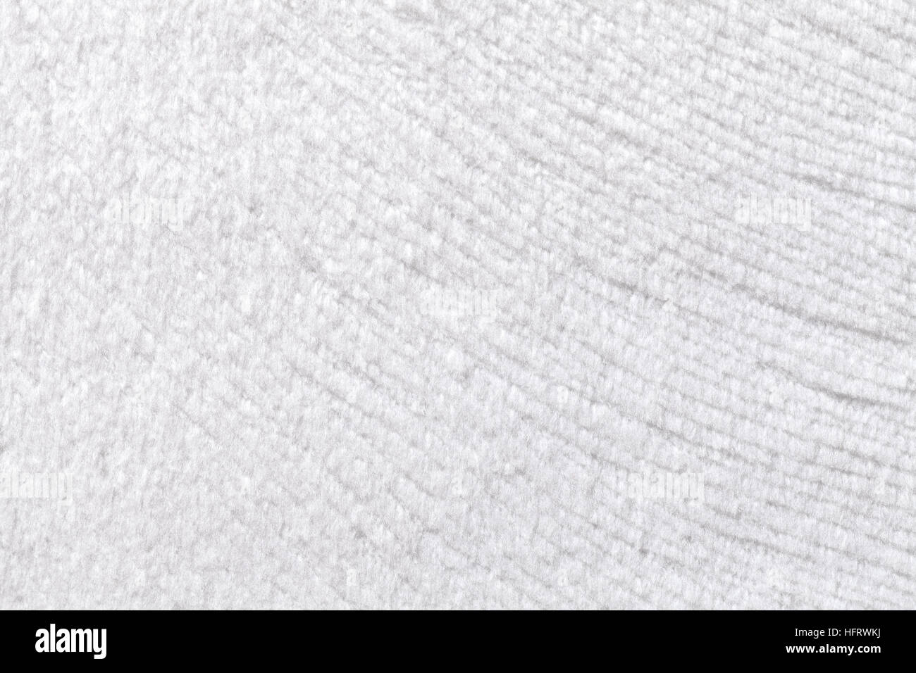 White background from a soft wool textile material closeup. Fabric with ...