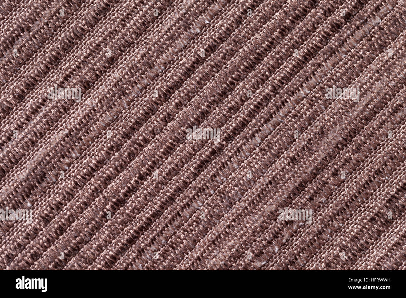 Brown background of a knitted textile material with diagonal pattern ...