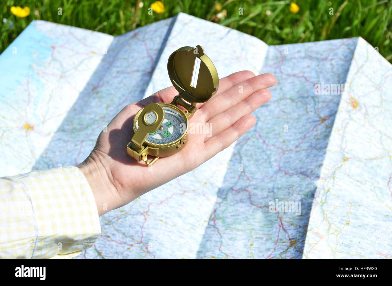 Traveler with a compass in the hand Stock Photo - Alamy