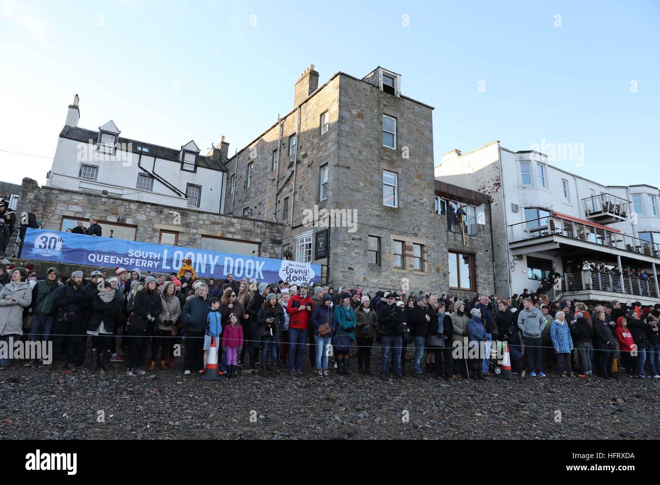 People attend the Loony Dook New Year's Day dip in the Firth of Forth ...