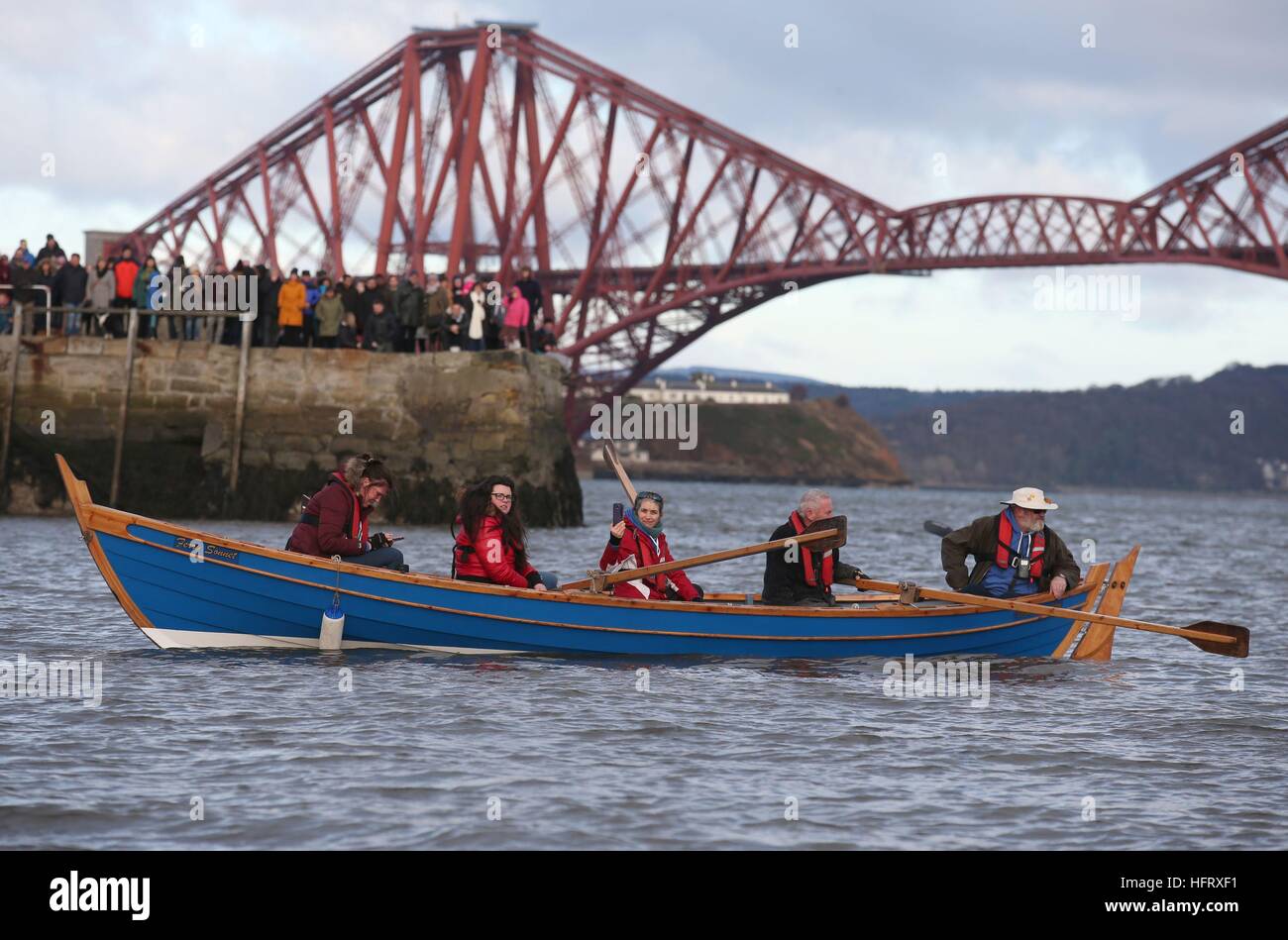 People attend the Loony Dook New Year's Day dip in the Firth of Forth ...