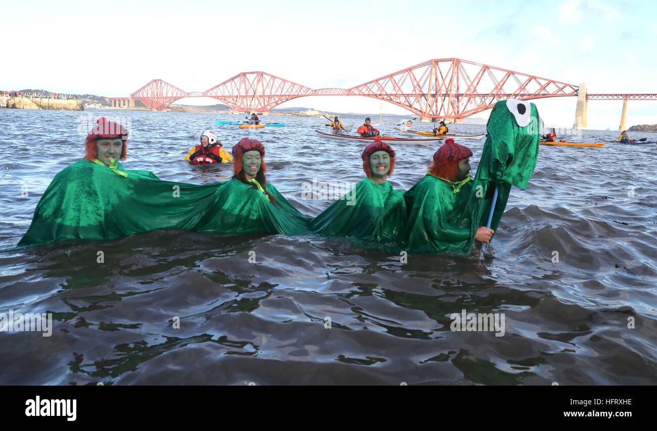 Swimmers take part in the Loony Dook New Year's Day dip in the Firth of ...