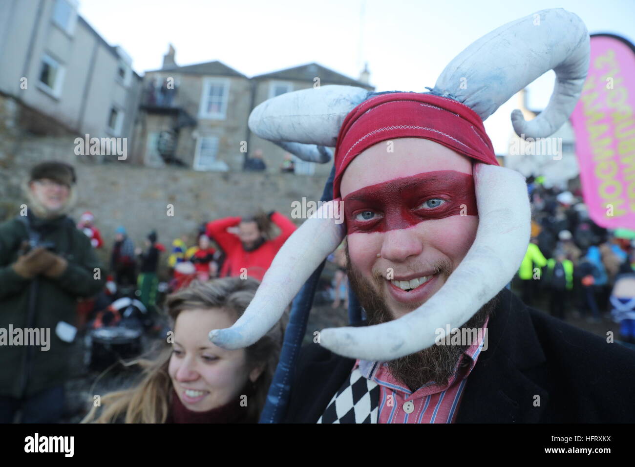 People attend the Loony Dook New Year's Day dip in the Firth of Forth ...
