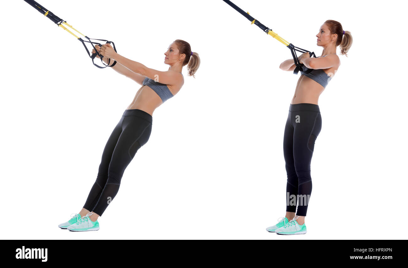 Athletic woman performing a functional exercise with suspension cable ...