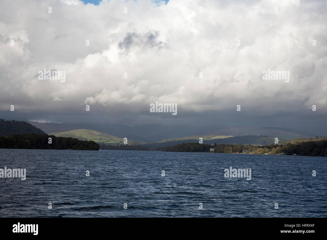 Storm clouds passing across the mountains to the north of Windermere ...