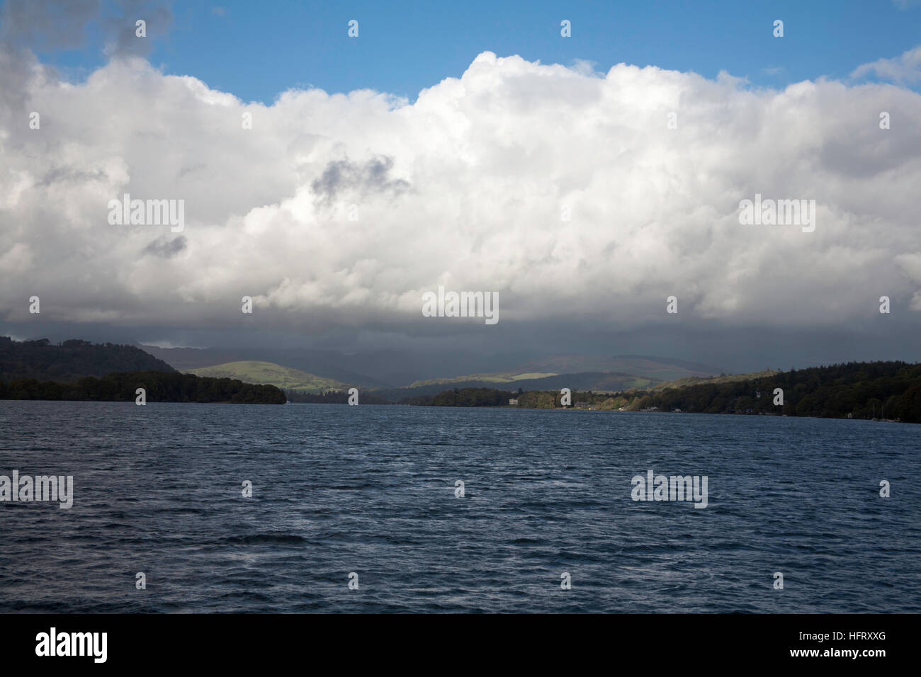 Storm clouds passing across the mountains to the north of Windermere ...