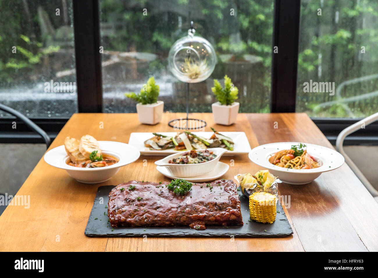 dining table with food ready to eat Stock Photo - Alamy