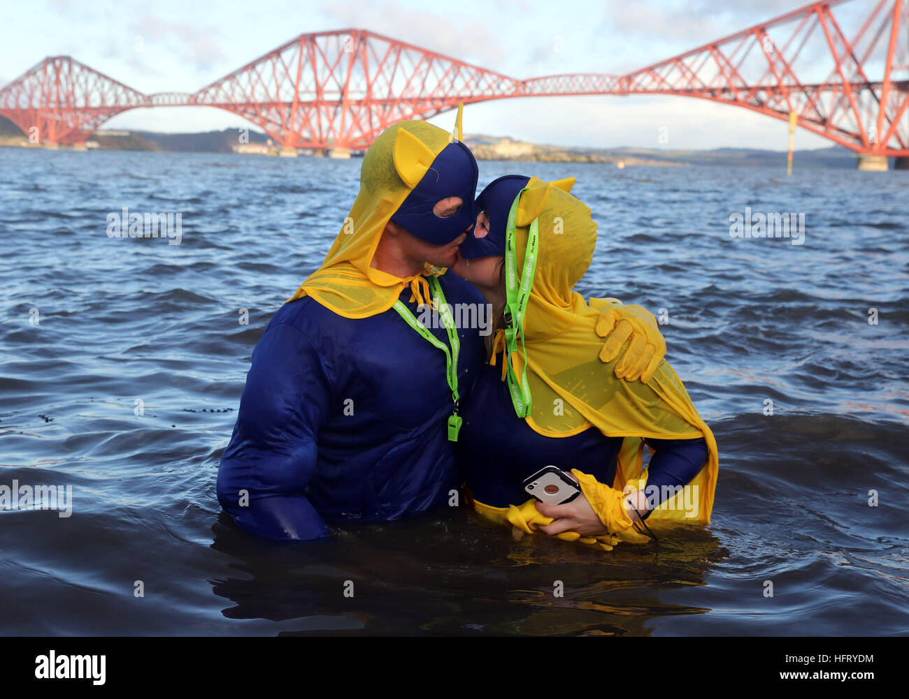 Swimmers take part in the Loony Dook New Year's Day dip in the Firth of ...