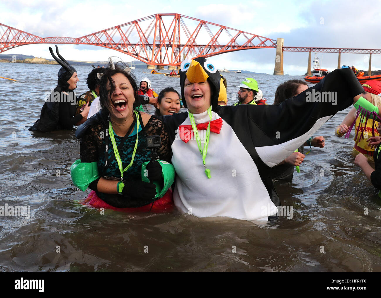 Swimmers take part in the Loony Dook New Year's Day dip in the Firth of ...