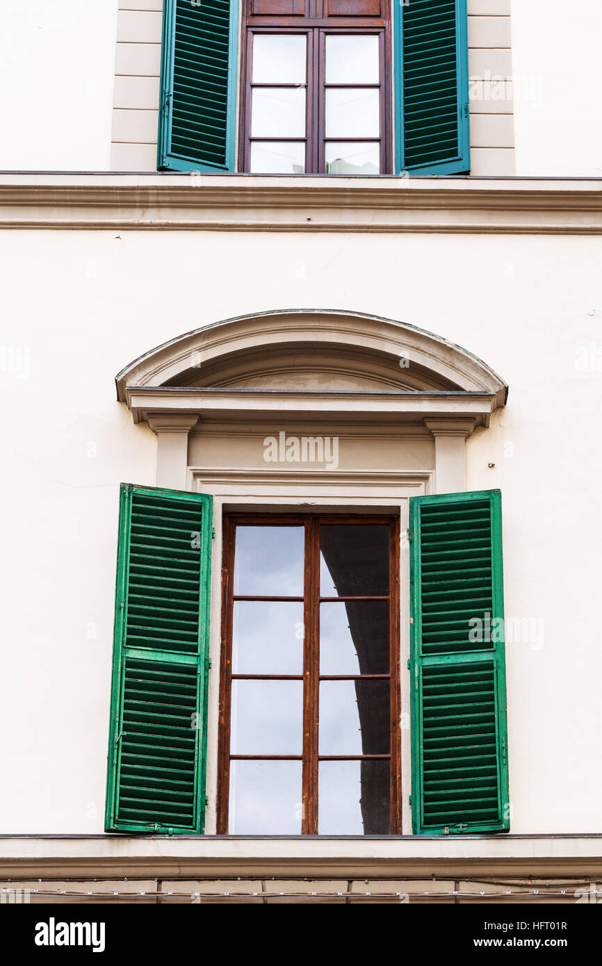 travel to Italy - window with green blinds in urban house in Florence ...