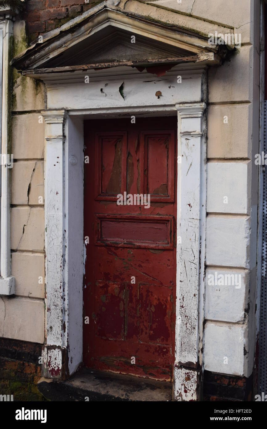 A decaying derelict red door to an old building in Birmingham's Gun ...