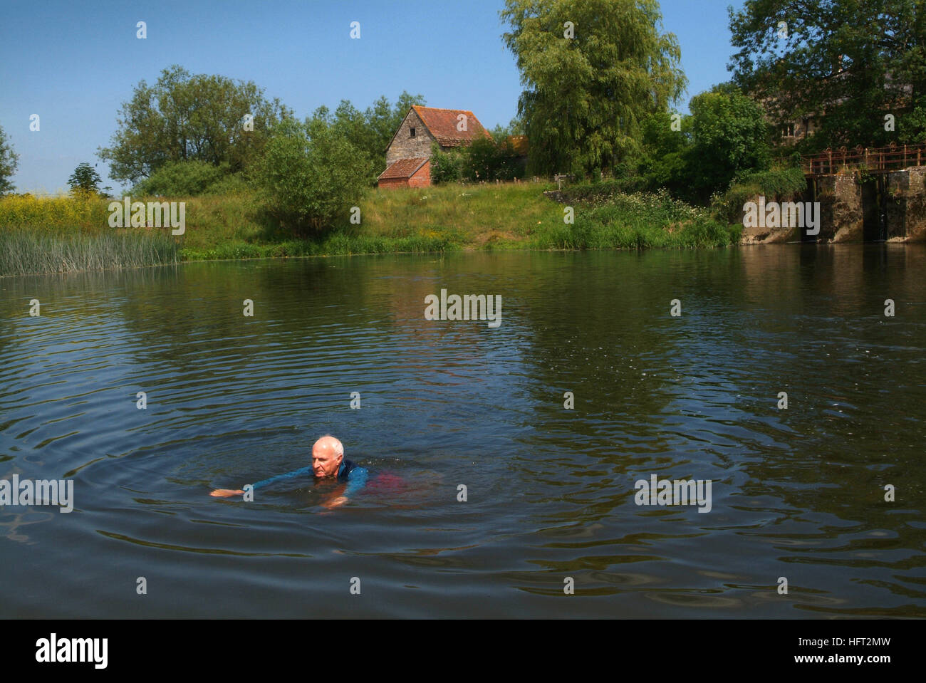 Rob Fryer free swimming in the River Stour at Fiddleford Weir, Dorset ...