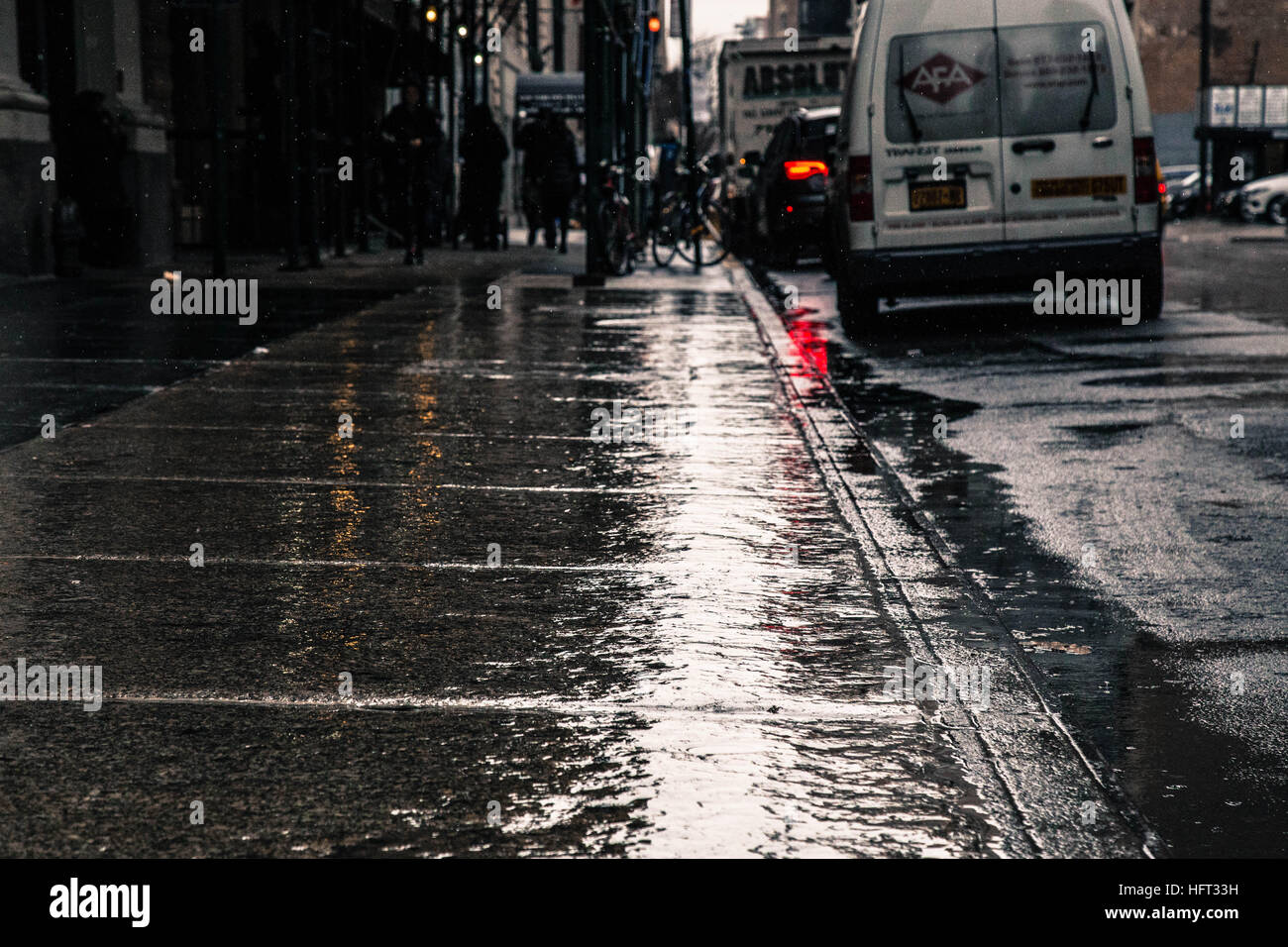 Reflections on a rainy street in Manhattan Stock Photo - Alamy