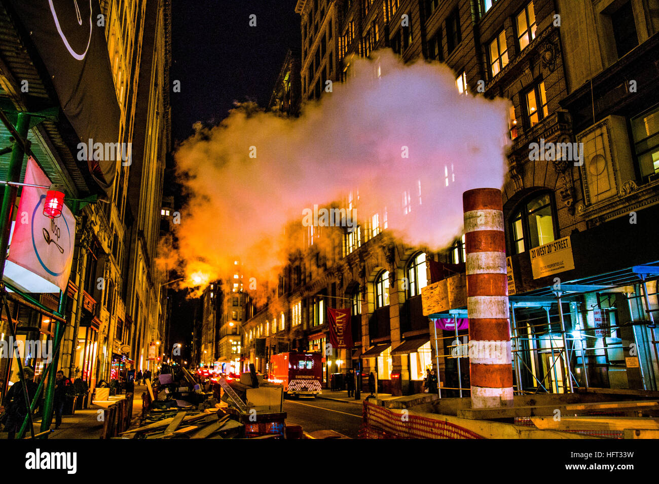 Smoke rising into the night sky on a street in Manhattan Stock Photo ...