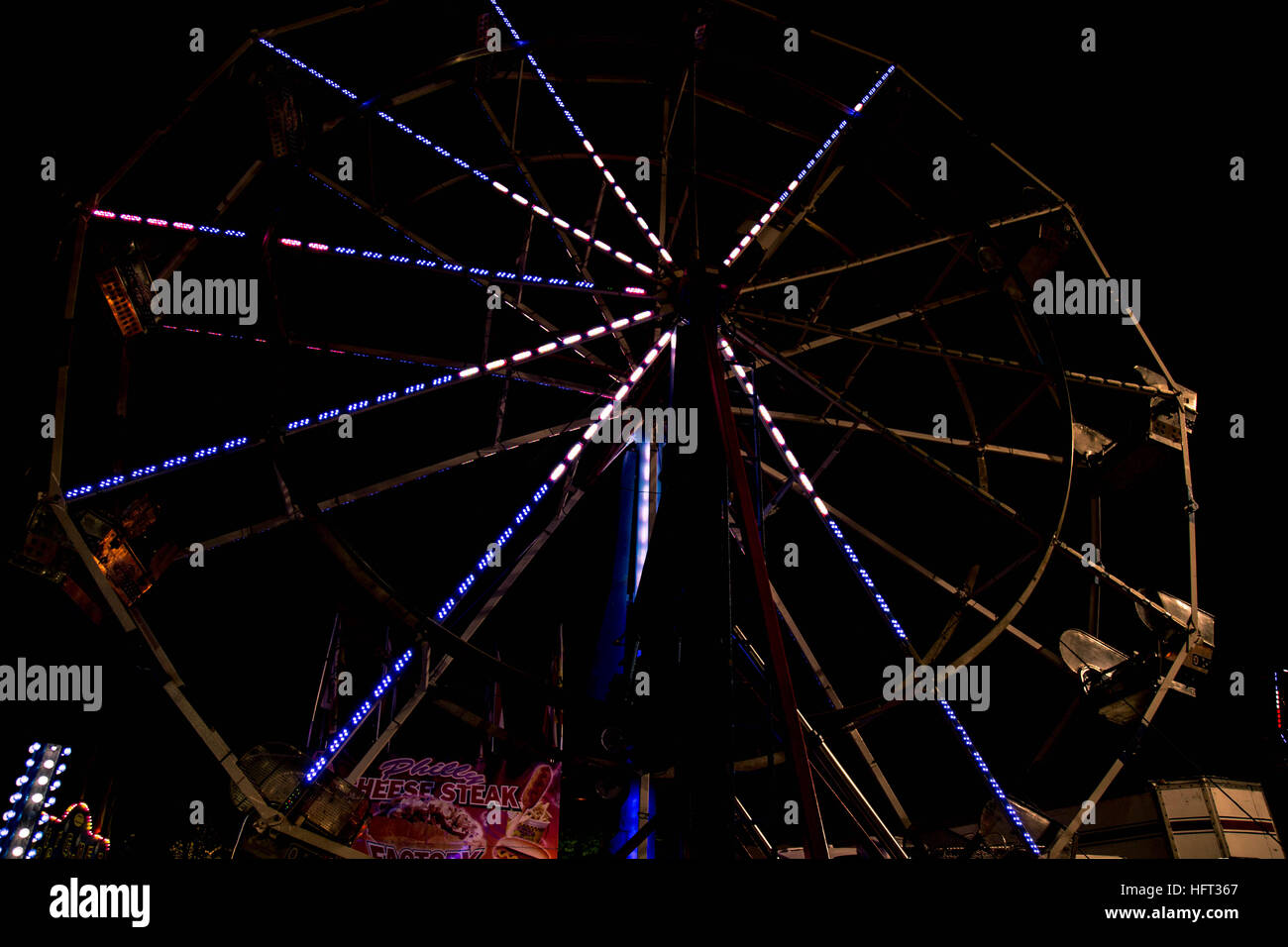 Ferris wheel at an amusement park at night Stock Photo - Alamy