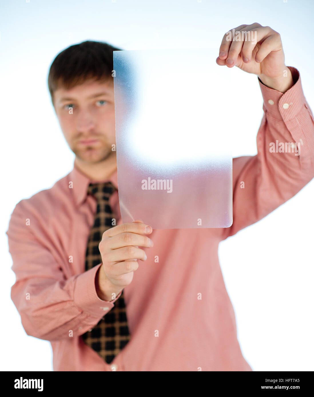 male showing something on transparent paper Stock Photo - Alamy