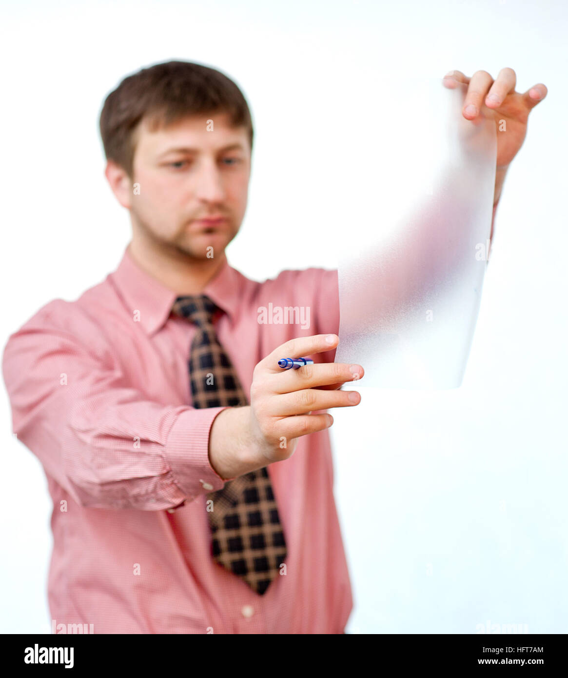 male showing something on transparent paper Stock Photo - Alamy