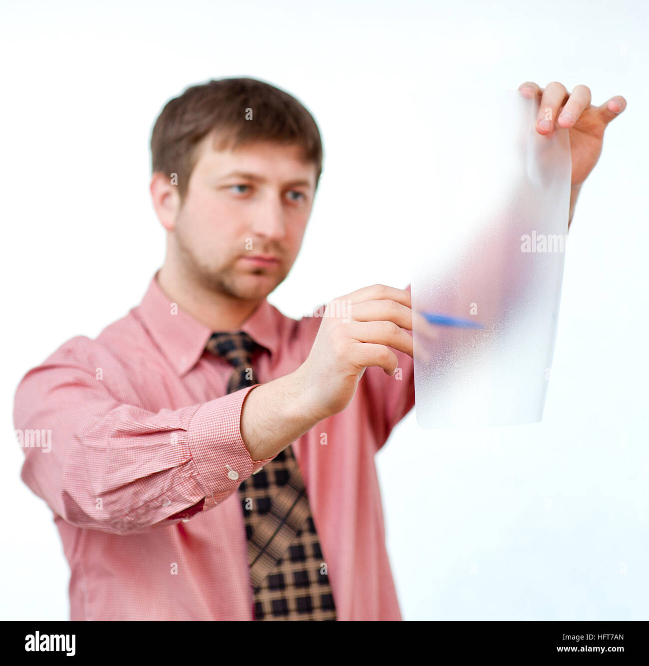 male showing something on transparent paper Stock Photo - Alamy