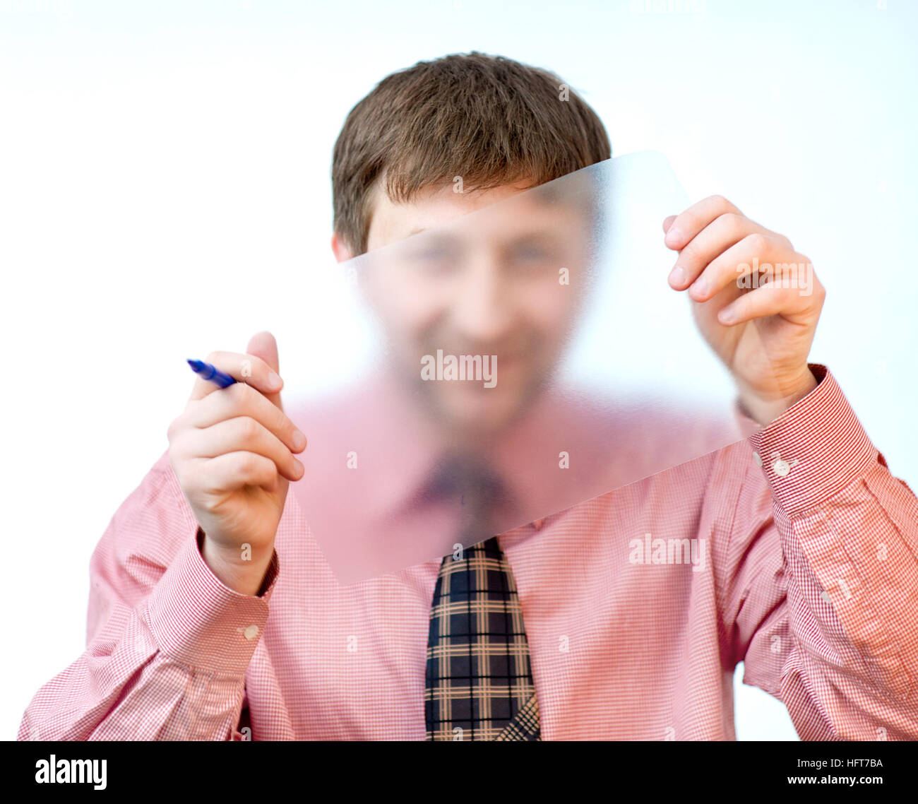 male showing something on transparent paper Stock Photo - Alamy