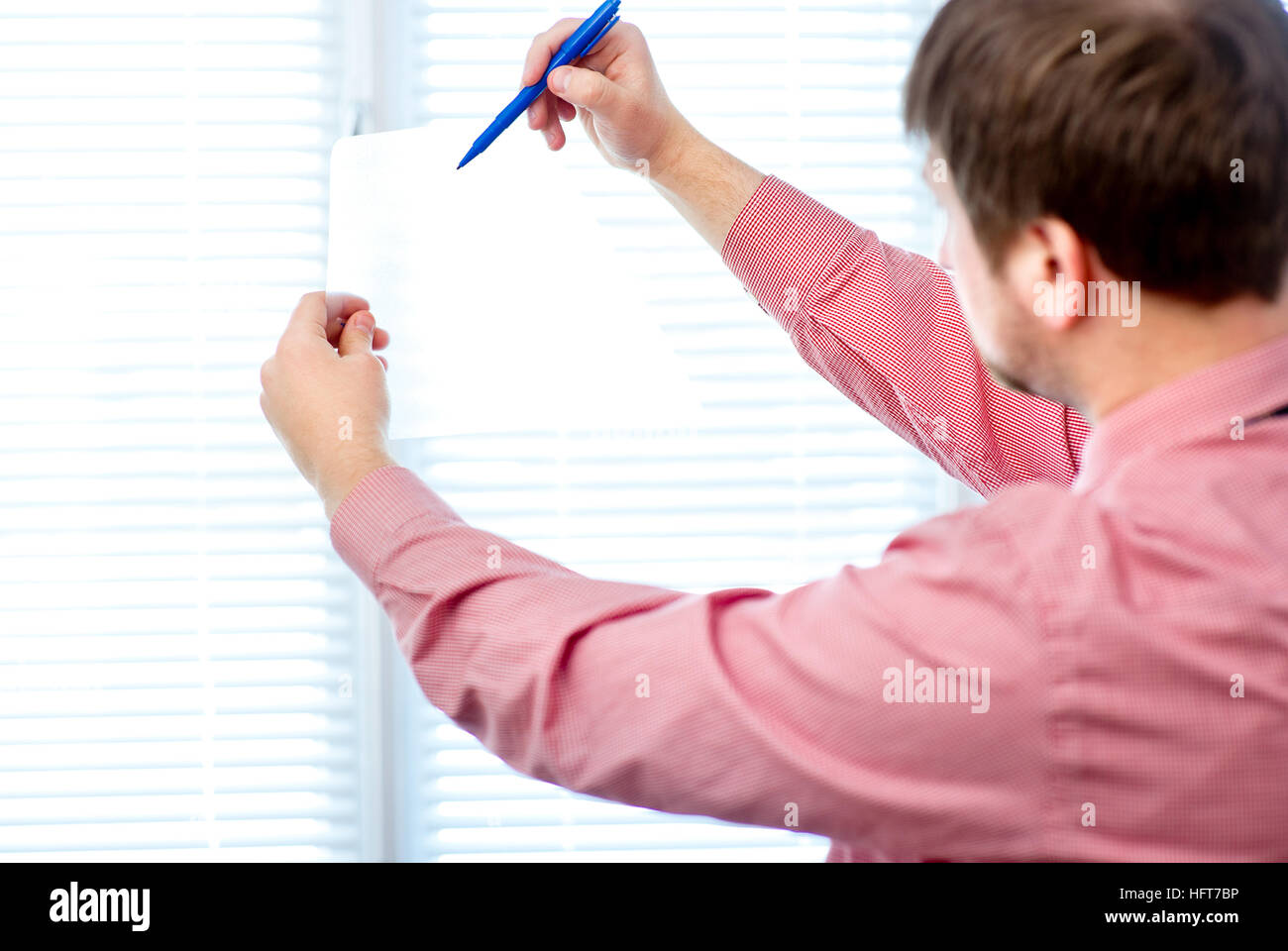 male writing something on transparent paper with marker Stock Photo - Alamy