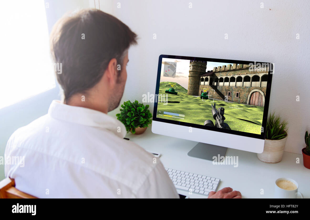 Man playing war videogame on computer Stock Photo - Alamy