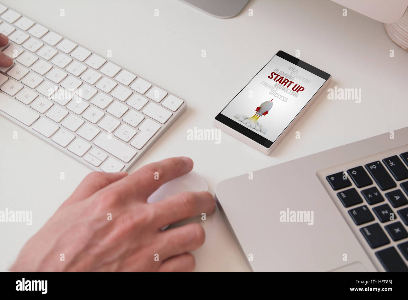 office desktop with start up screen smartphone Stock Photo - Alamy