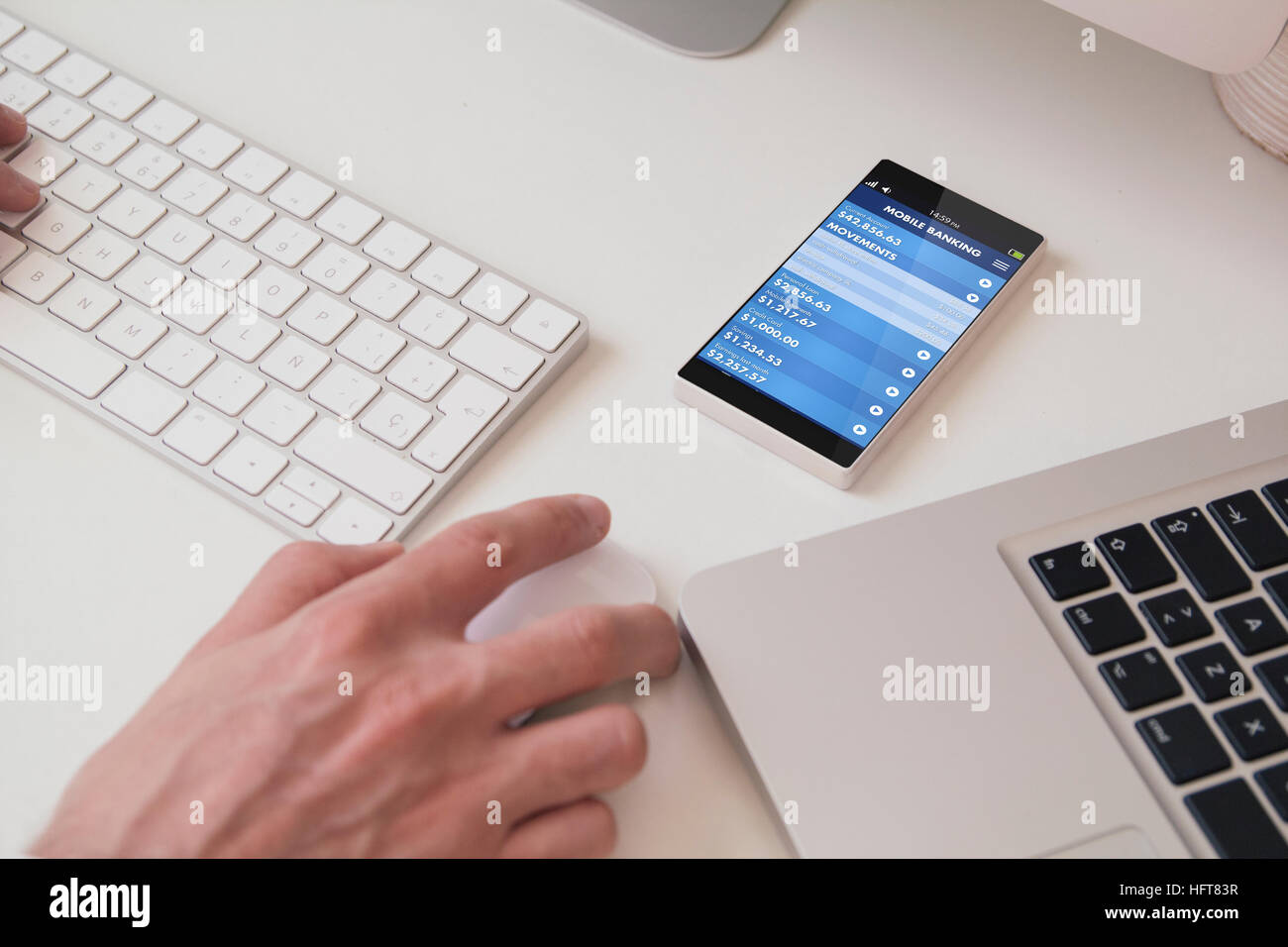office desktop with mobile banking screen smartphone Stock Photo - Alamy