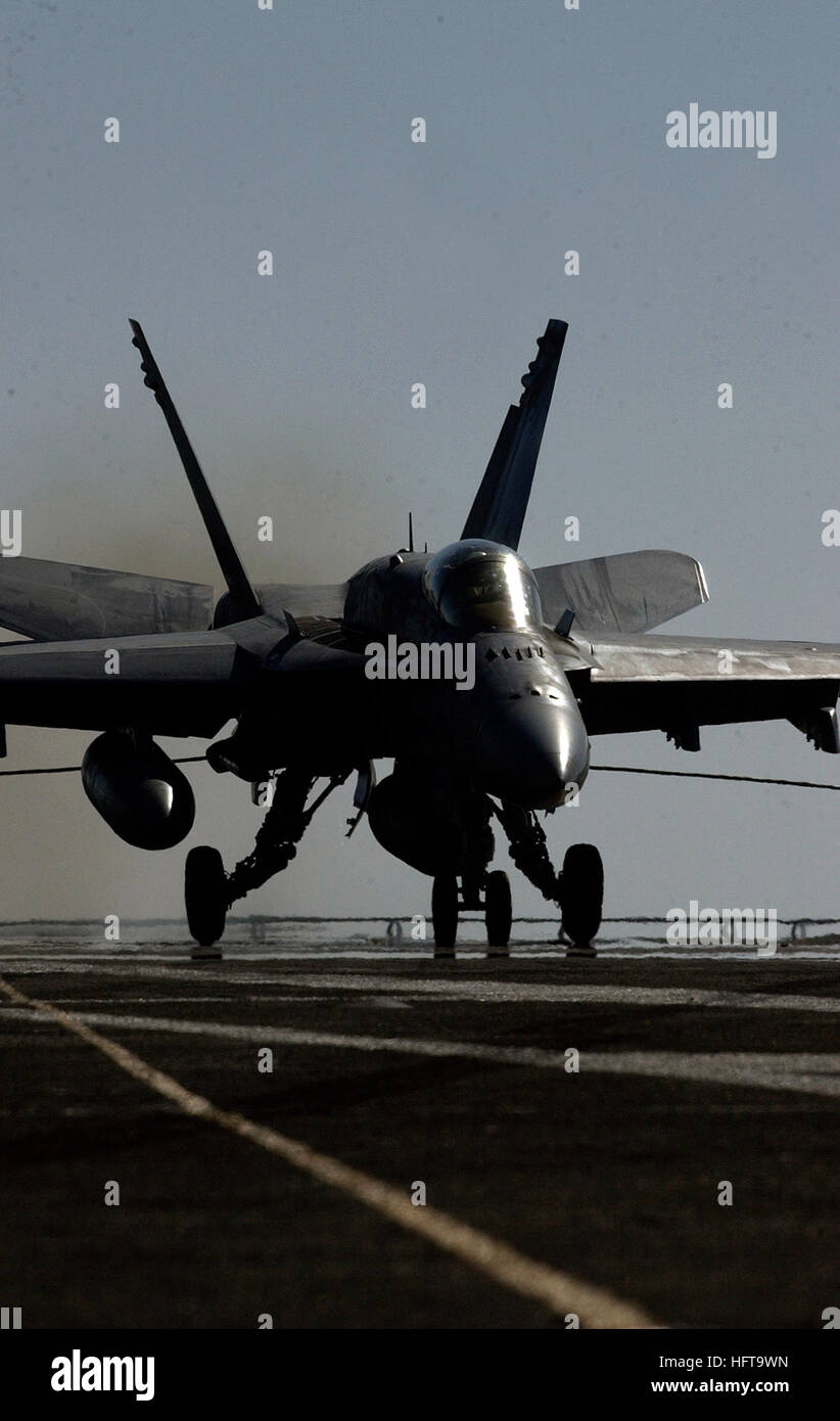 An F/A-18C Hornet performs an arrested landing on USS Ronald Reagan ...