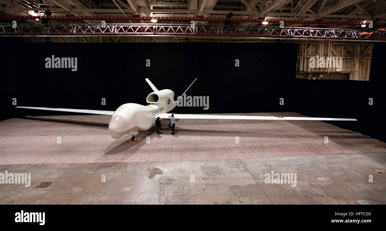A Global Hawk unmanned aerial vehicle is staged in a hangar before ...