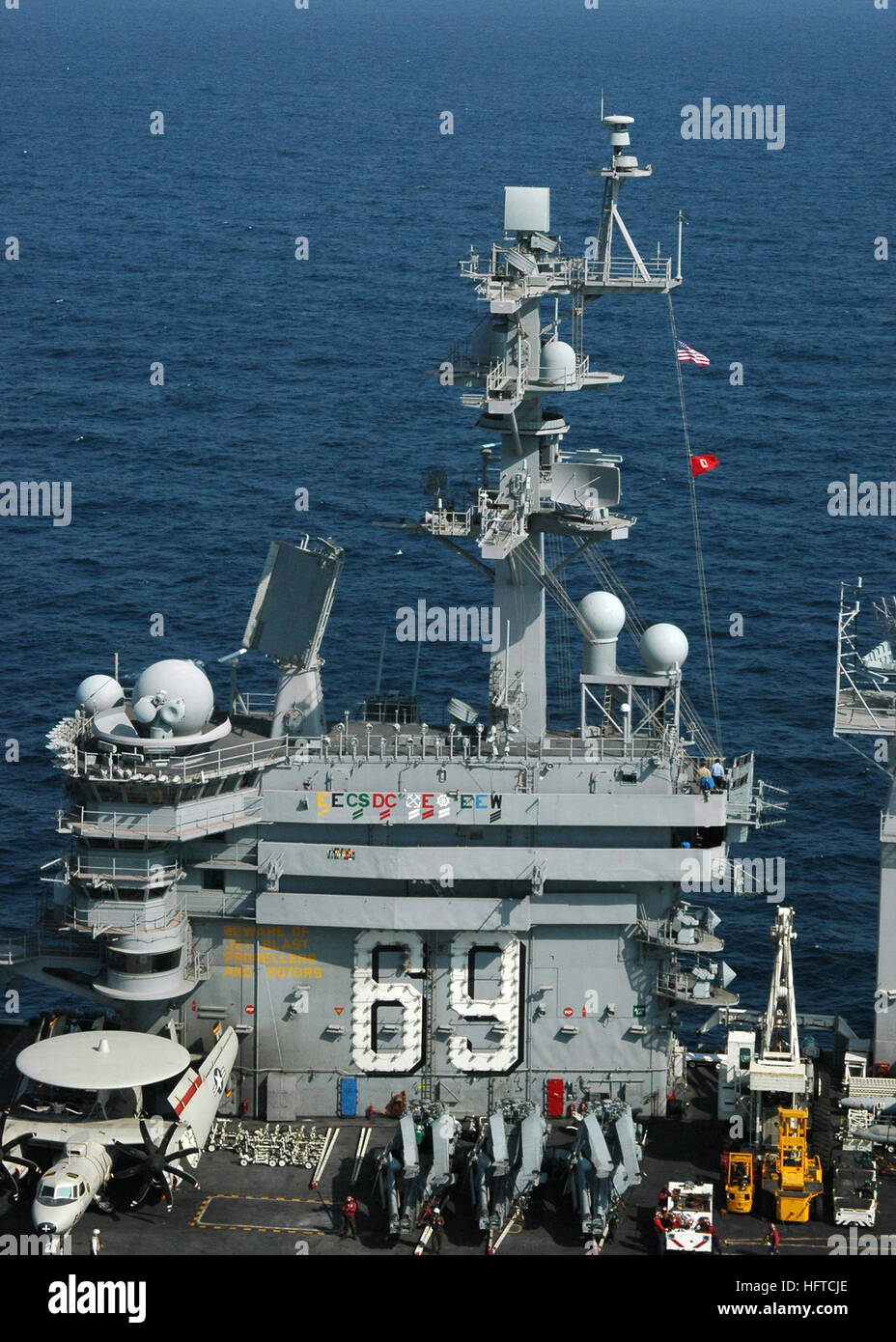 A flag is displayed aboard USS Dwight D. Eisenhower while the carrier ...