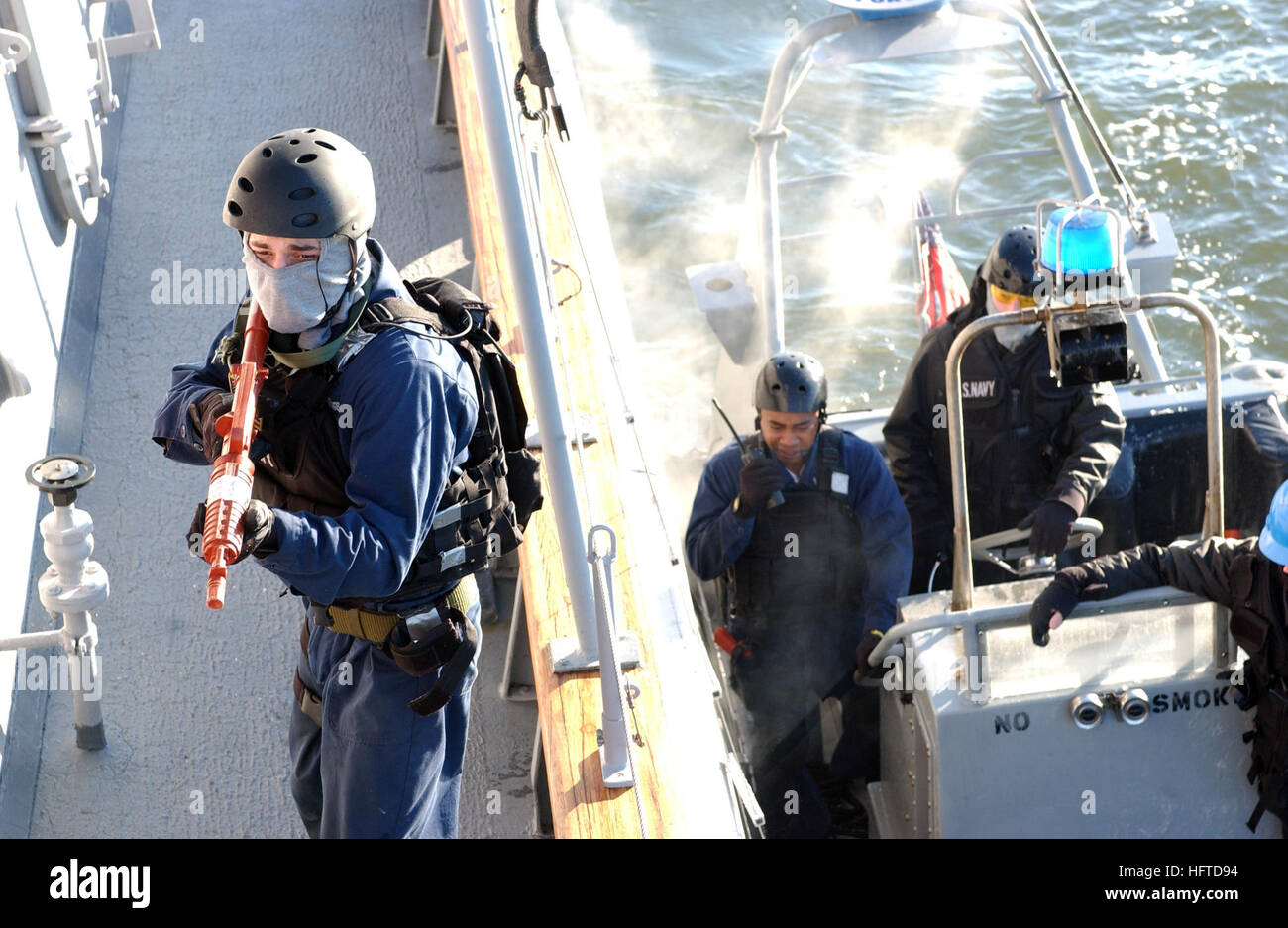 A Visit, Board, Search and Seizure (VBSS) Sailor aboard coastal patrol ...