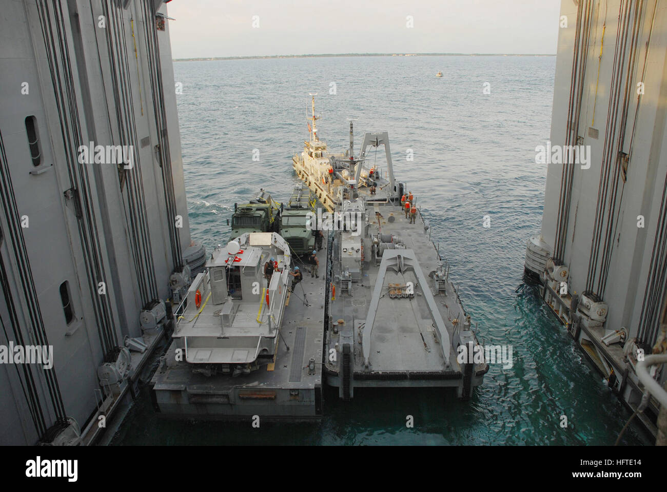 Sailors from Amphibious Construction Battalion One offload the Improved ...